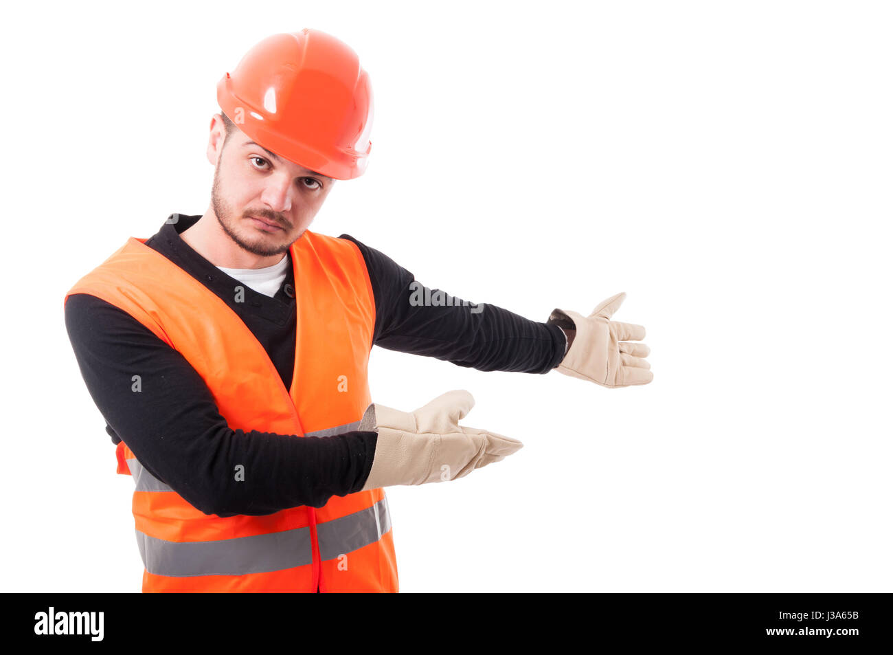 Architect or builder indicate something at blank copyspace behind him ...