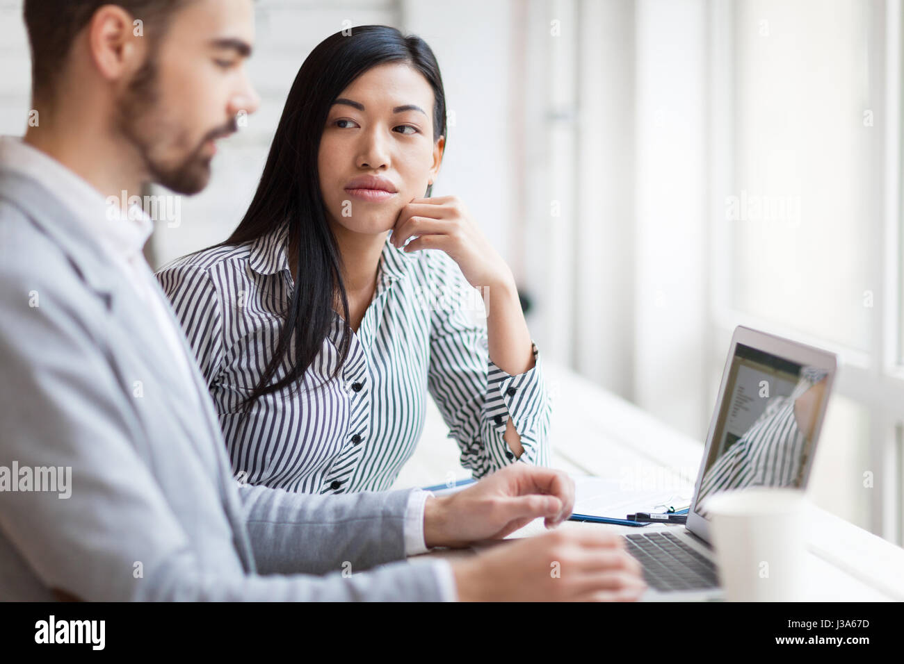 Sharing Ideas with Colleague Stock Photo - Alamy