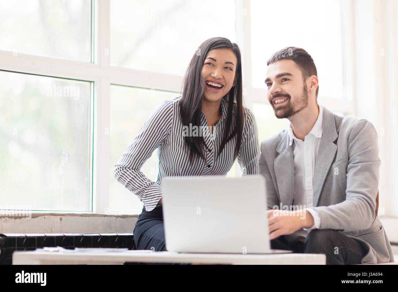 Office Workers in Good Mood Stock Photo - Alamy
