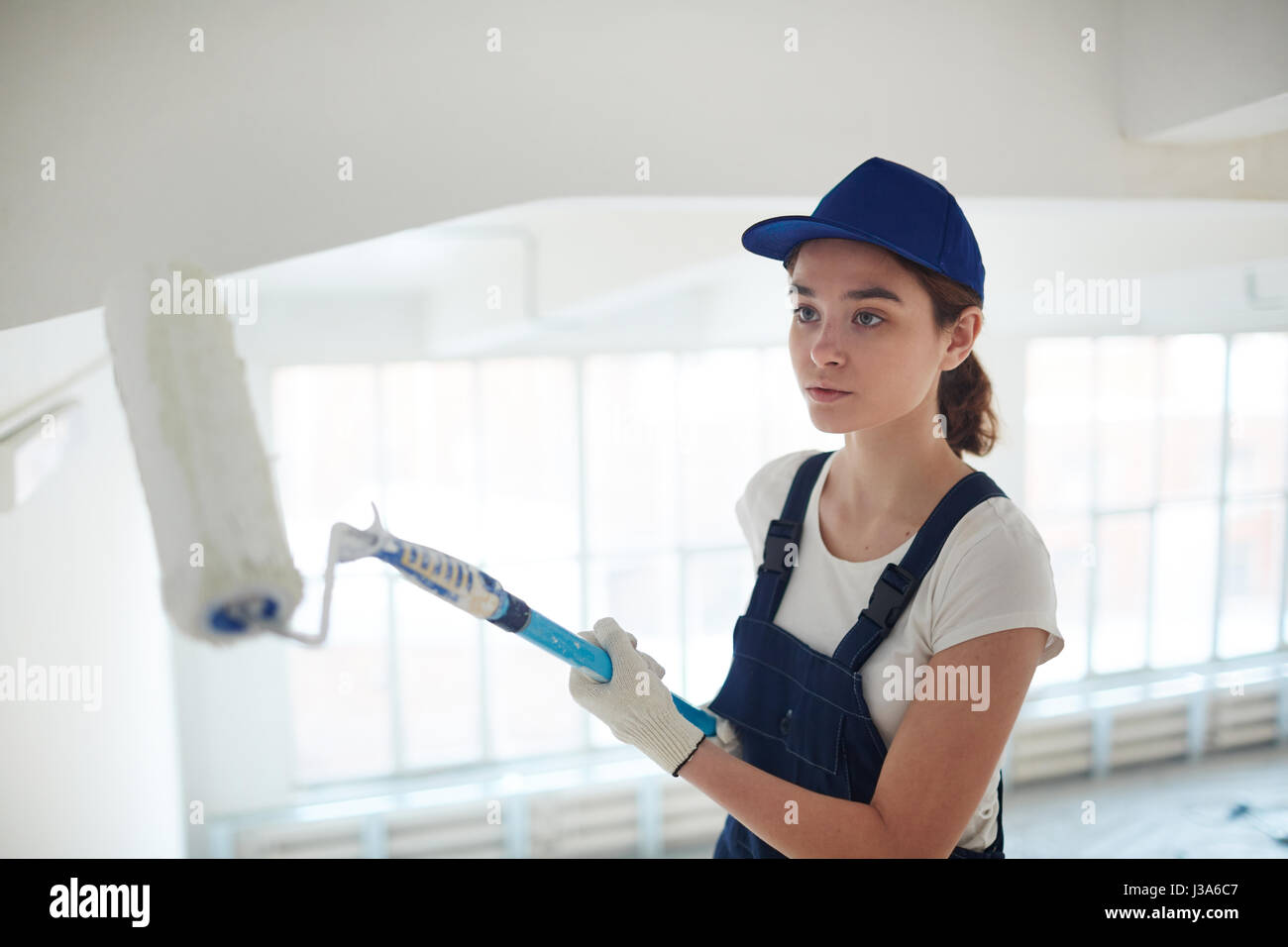 Worker painting ceiling white hi-res stock photography and images - Alamy