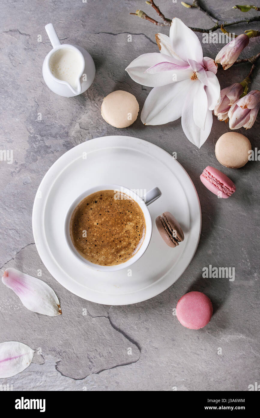 Cup of black coffee with magnolia Stock Photo - Alamy
