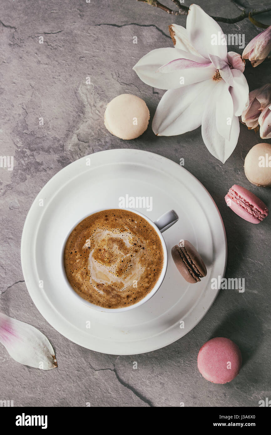 Cup of black coffee with magnolia Stock Photo - Alamy