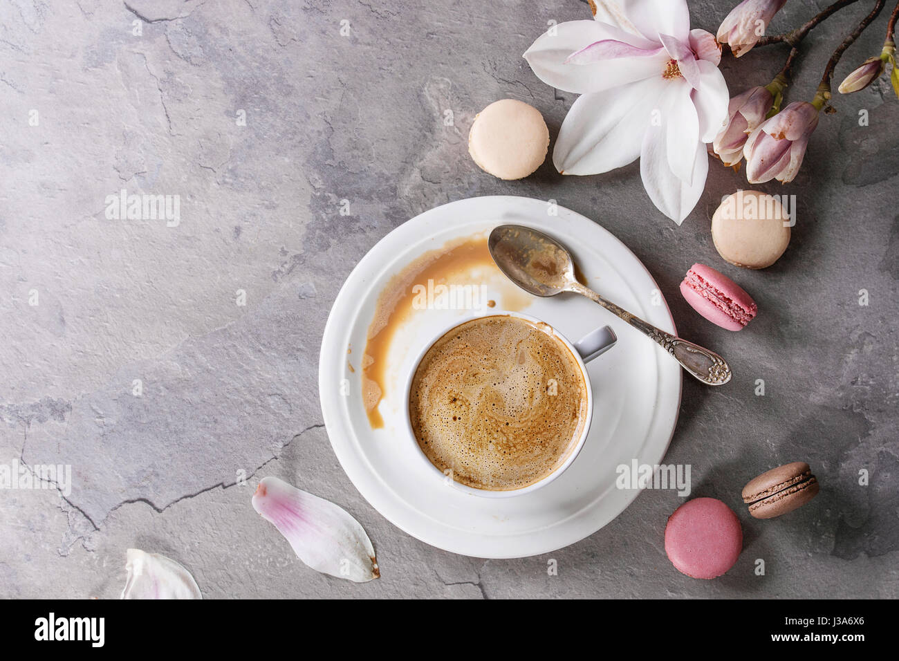 Cup of black coffee with magnolia Stock Photo - Alamy