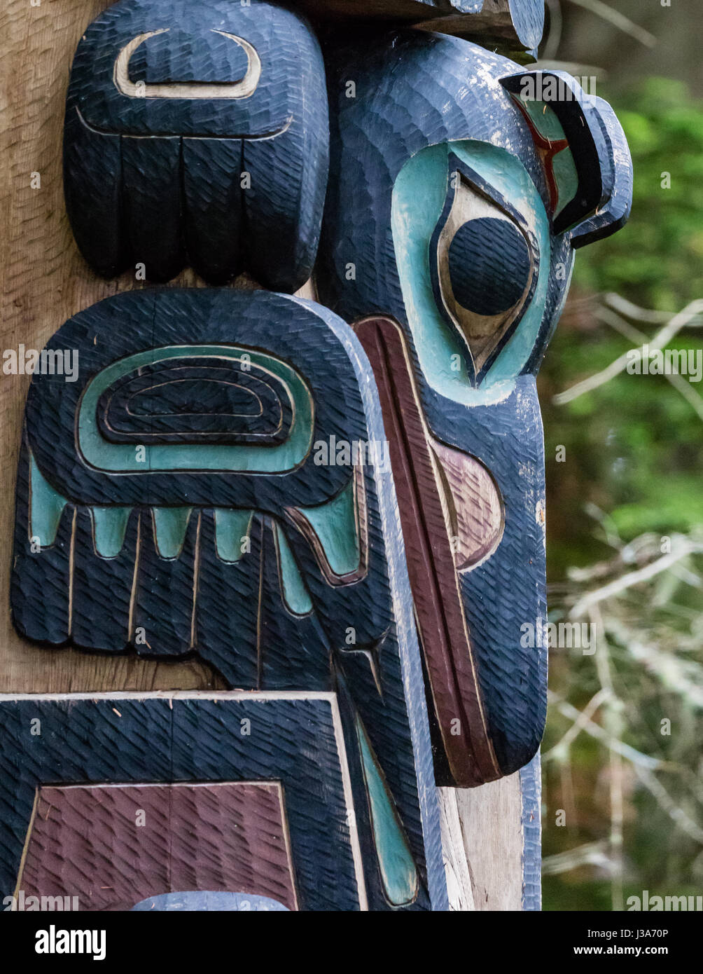 Native American totem poles in Alaska Stock Photo - Alamy