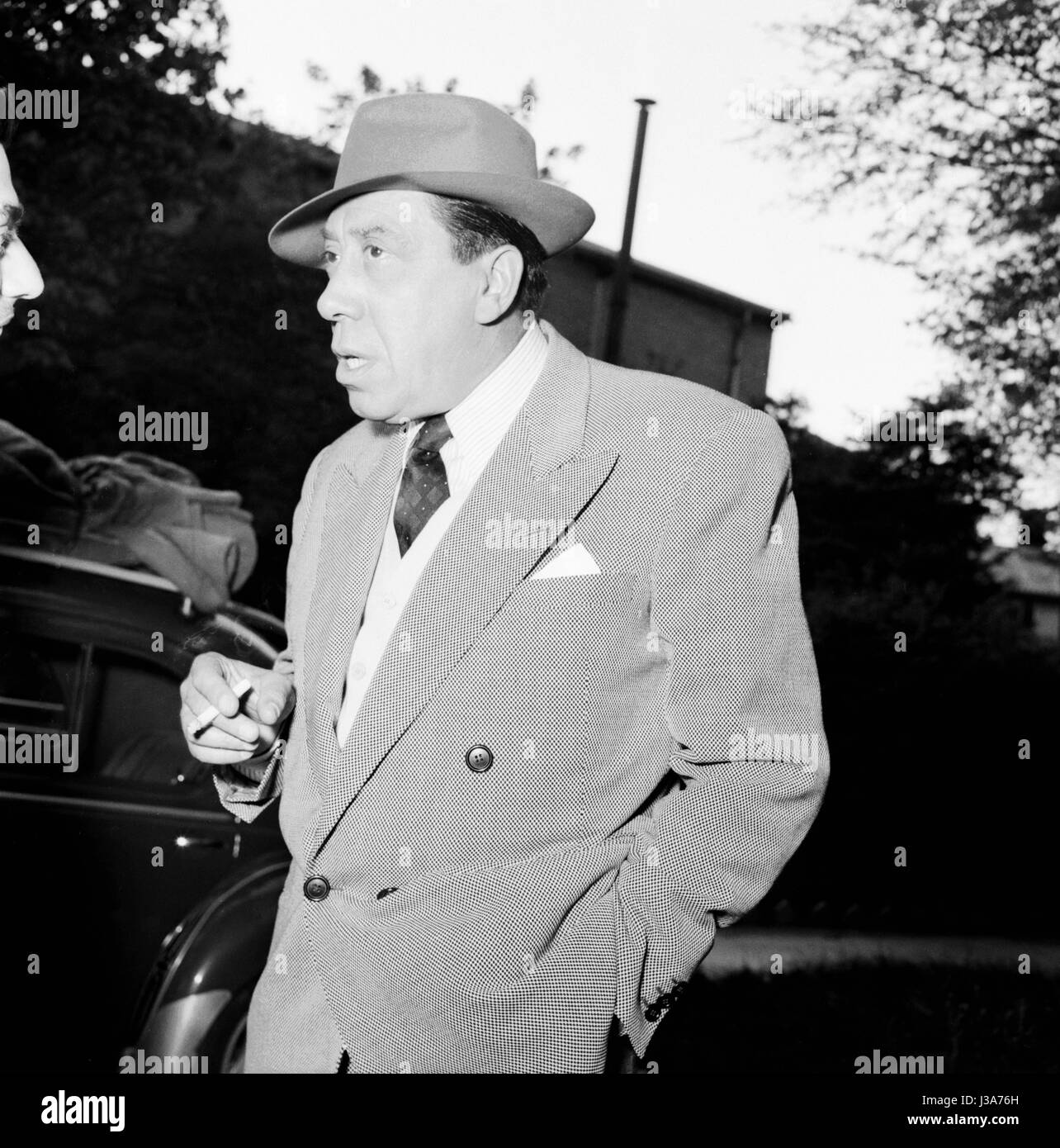 French actor Fernandel near his apartment located 44 avenue Foch in ...