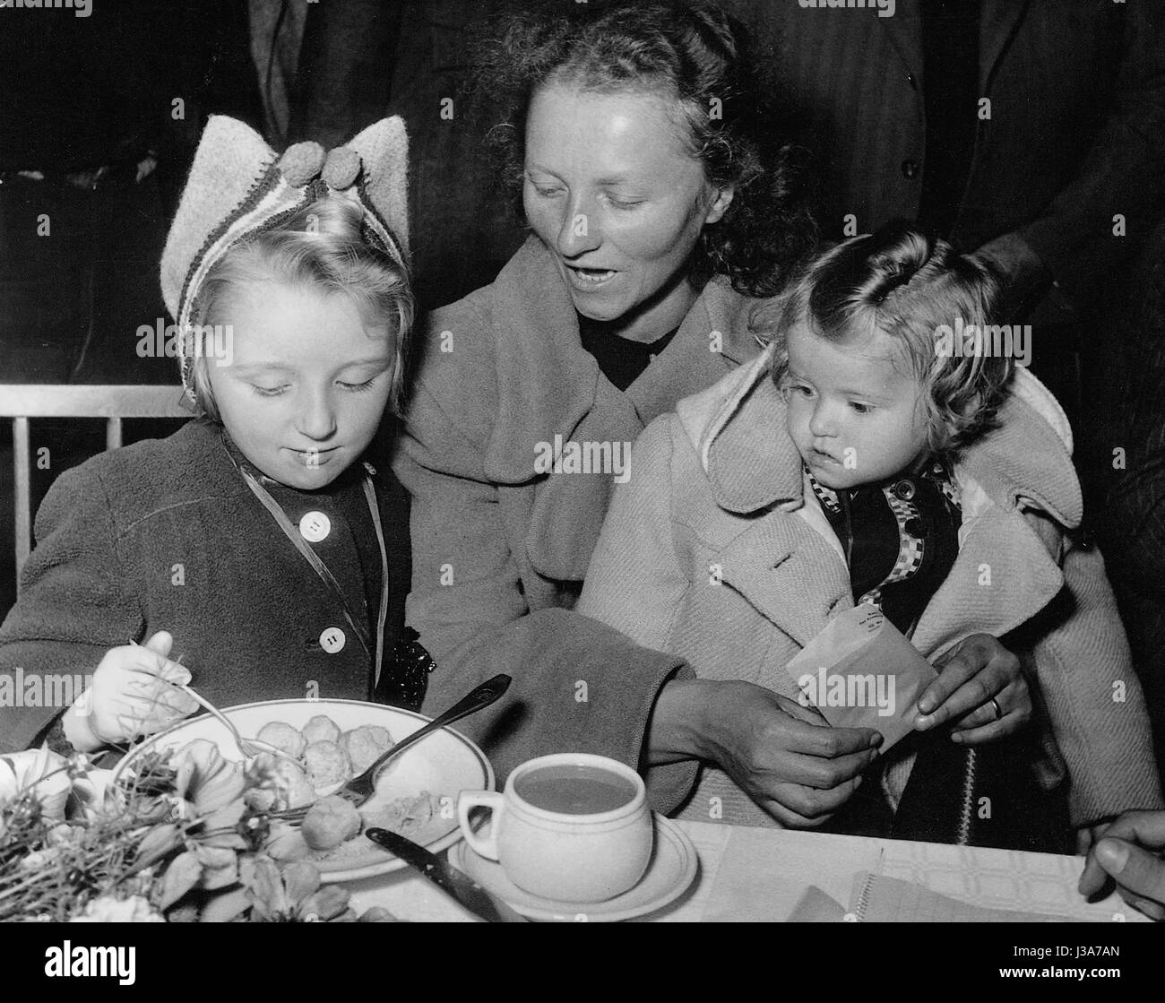 Returnee with children Stock Photo - Alamy