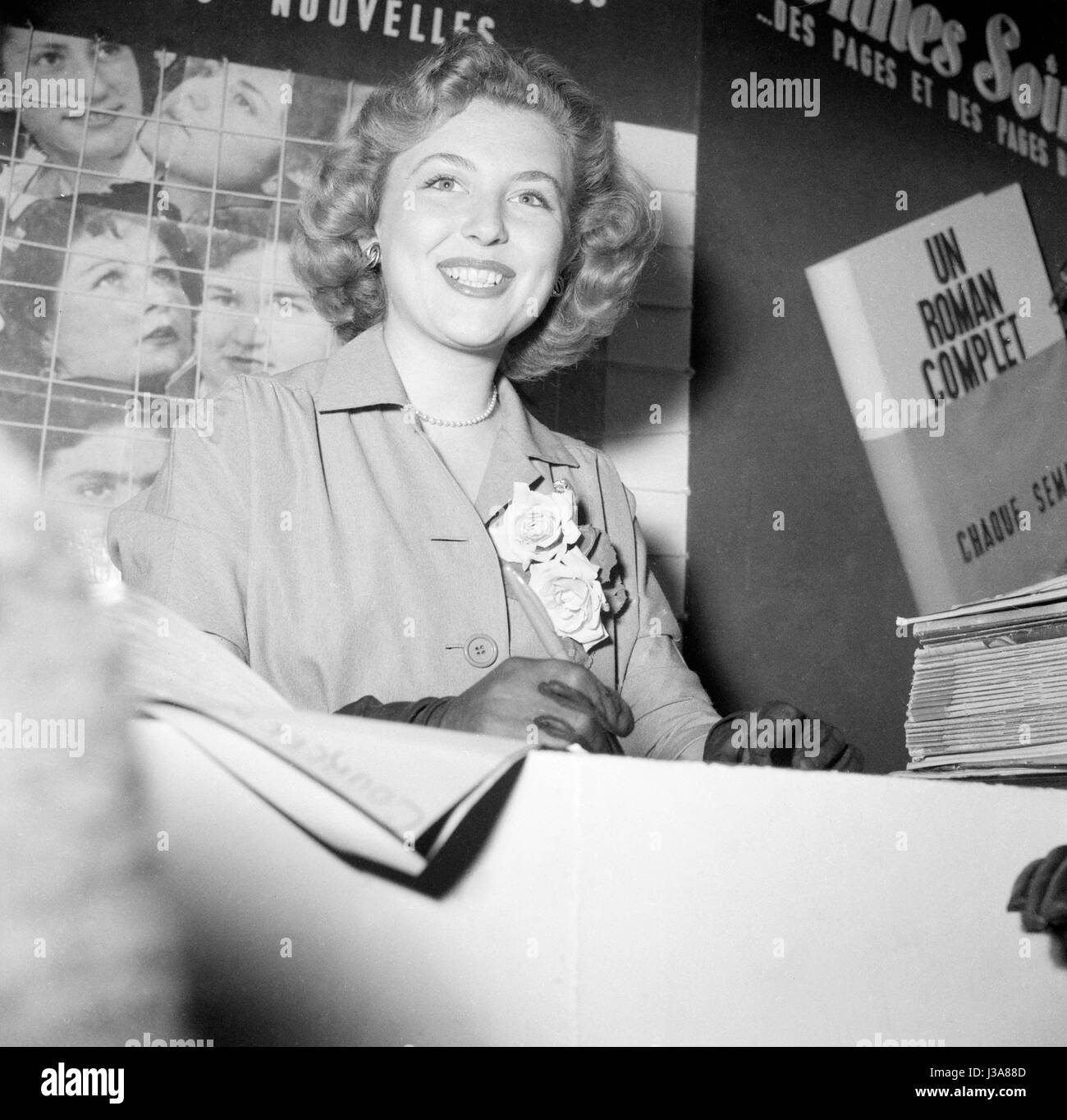 French actress Nicole Courcel signing autographs, c.1953 Stock Photo ...