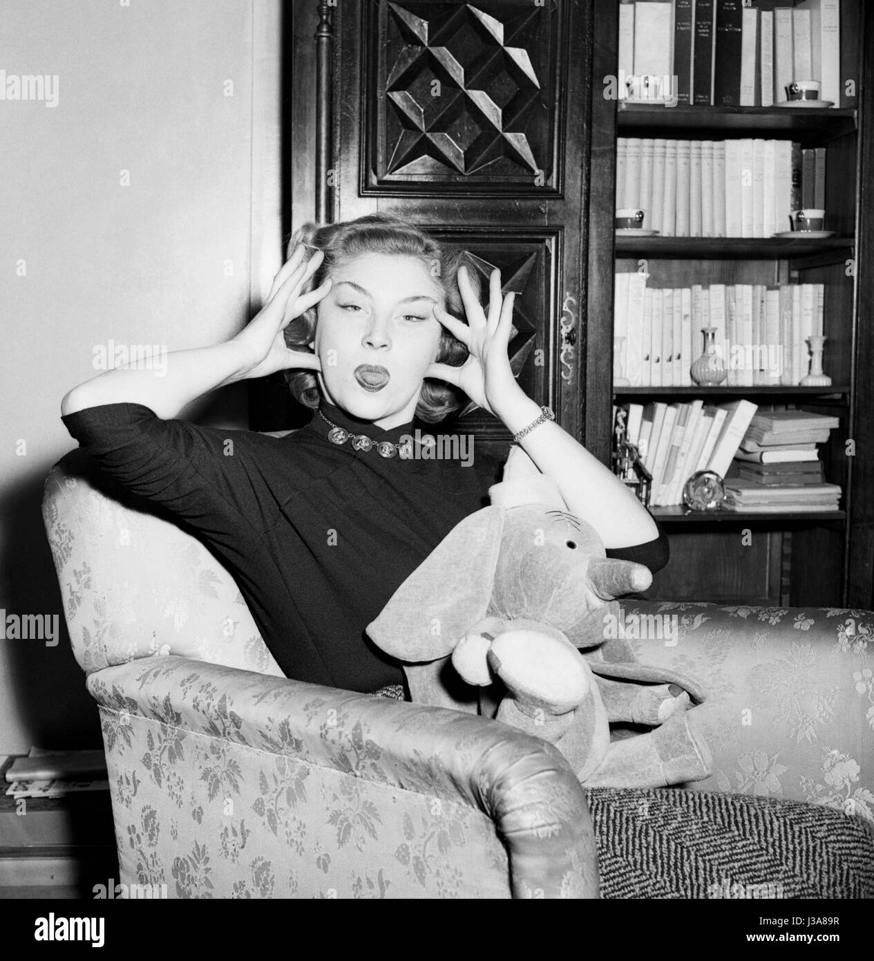 French actress Nicole Courcel signing autographs, c.1953 Stock Photo ...