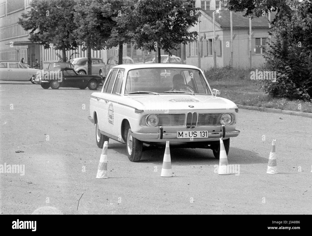Test drive with a BMW 1800 on a test track, 1963 Stock Photo - Alamy