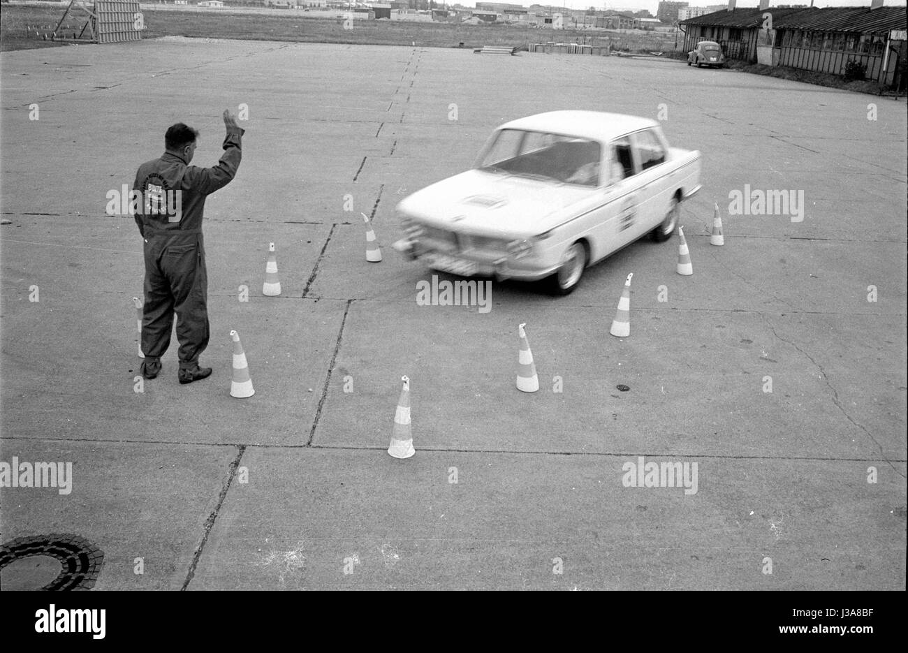 Test drive with a BMW 1800 on a test track, 1963 Stock Photo - Alamy