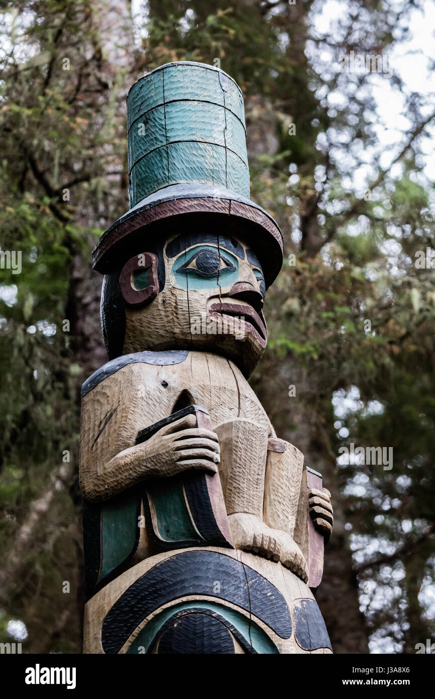 Native American totem poles in Alaska Stock Photo - Alamy