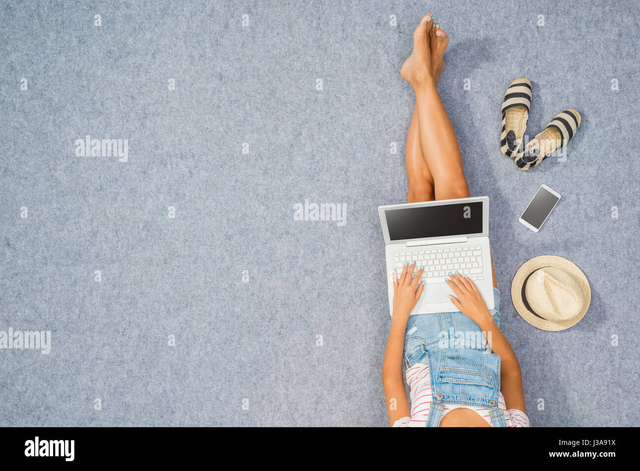Overhead shot of fashionable woman using computer Stock Photo - Alamy