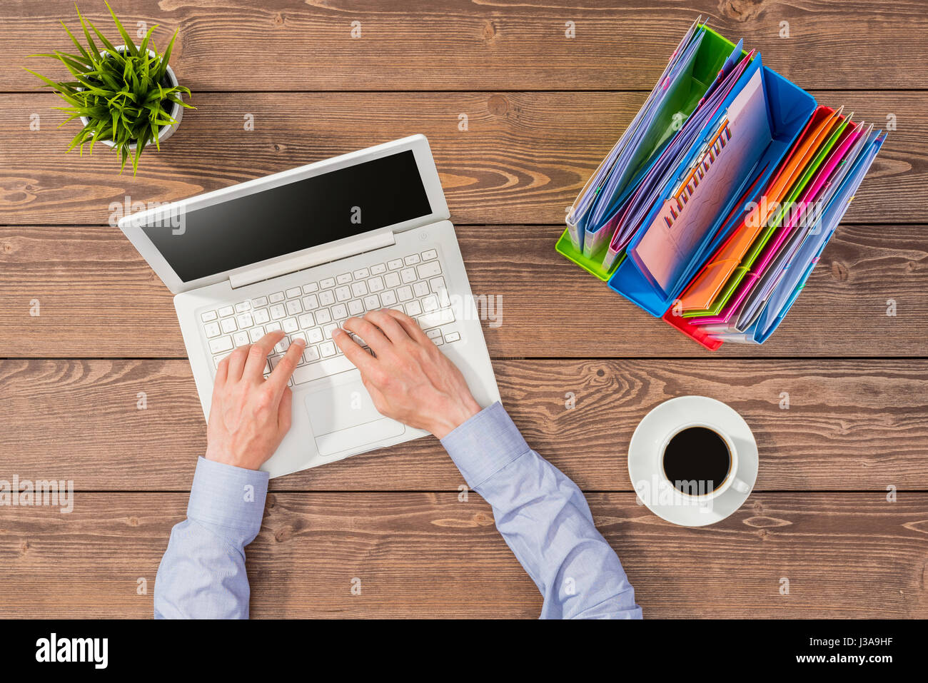 Business man using computer in an office Stock Photo - Alamy
