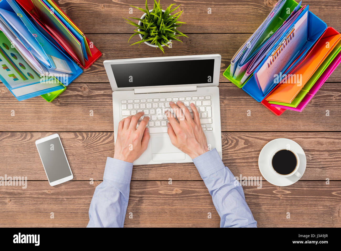 Business man using computer in an office Stock Photo - Alamy