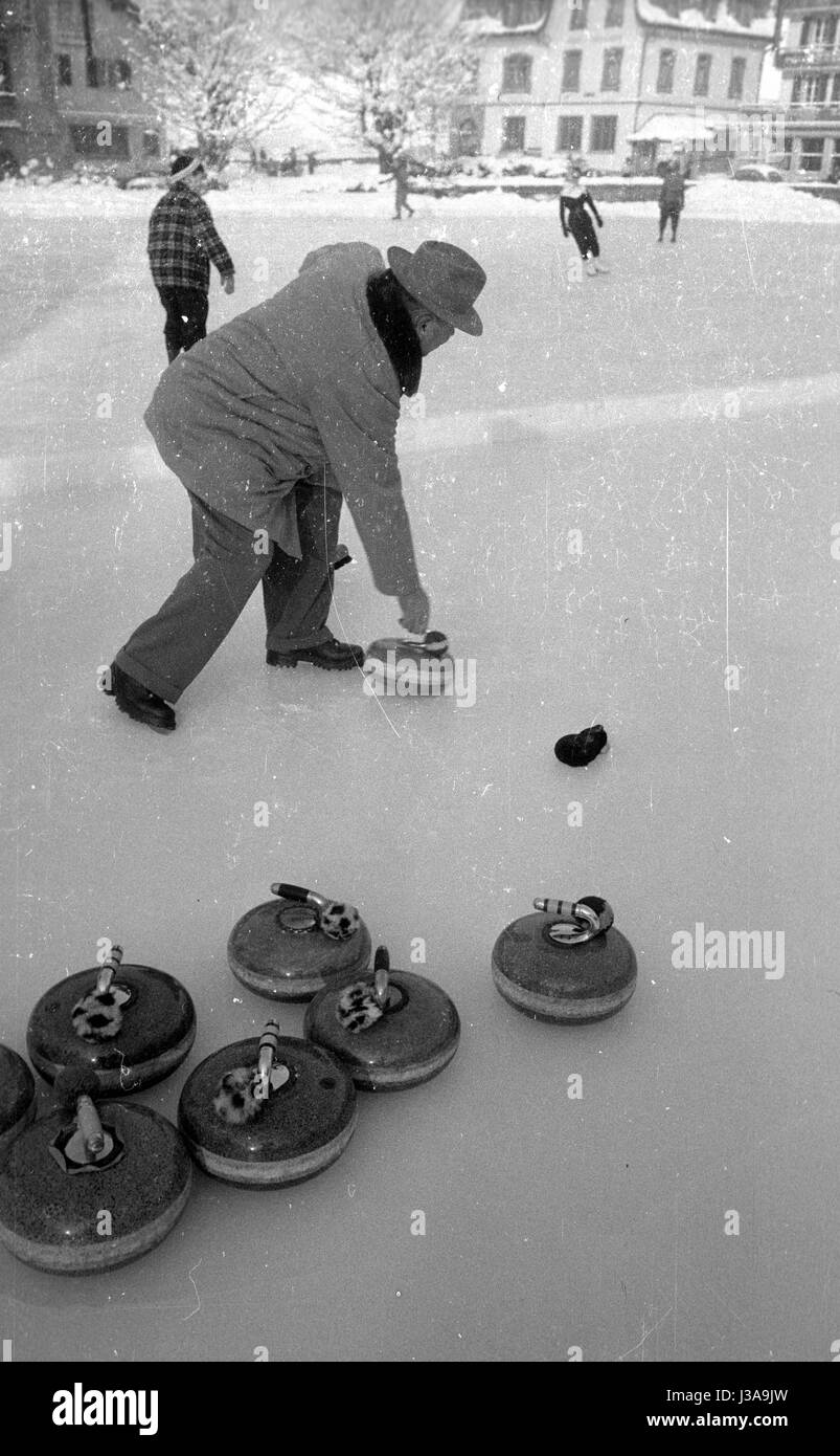 Curling stone slides on ice hi-res stock photography and images - Alamy