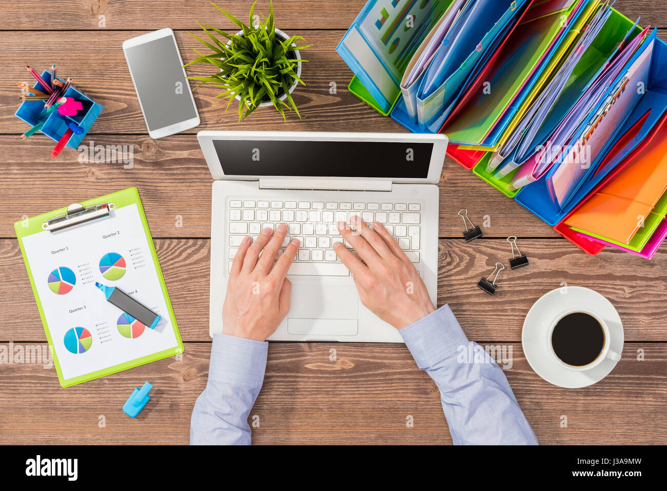 Business man using computer in an office Stock Photo - Alamy