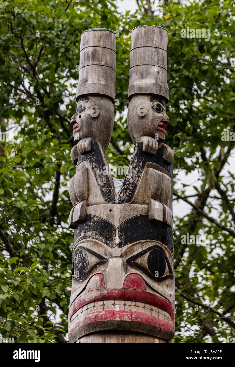 Native American totem poles in Alaska Stock Photo - Alamy
