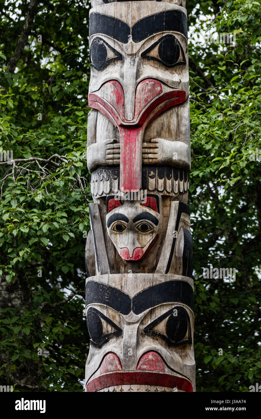 Native American totem poles in Alaska Stock Photo - Alamy