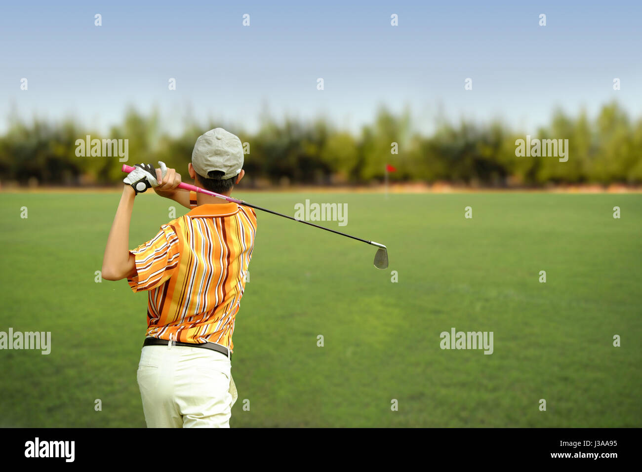 Golfers men player golf hit swing shot on course Stock Photo - Alamy