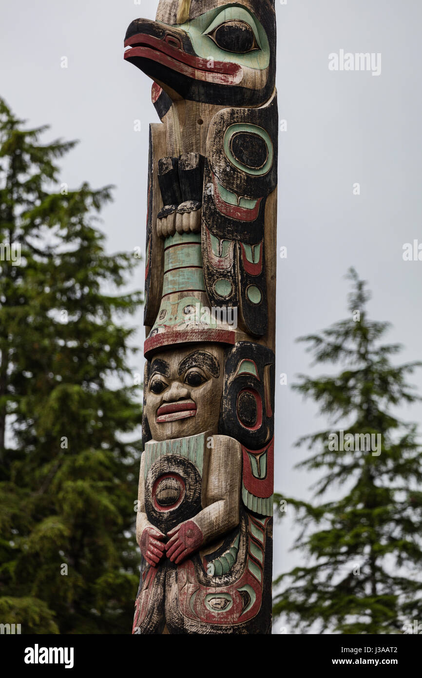 Native American totem poles in Alaska Stock Photo - Alamy