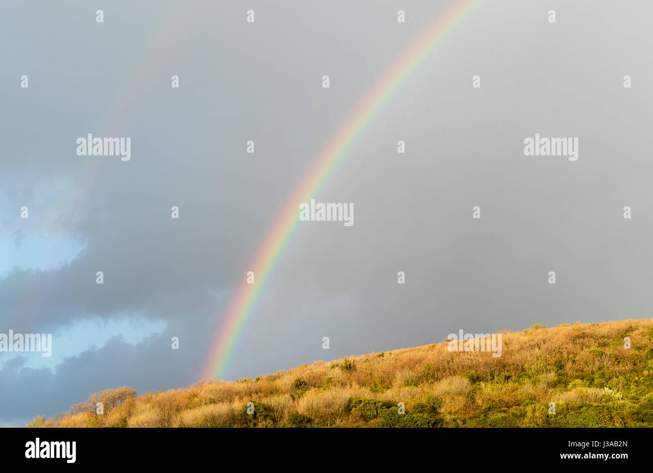 Rainbow reaching ground hi-res stock photography and images - Alamy