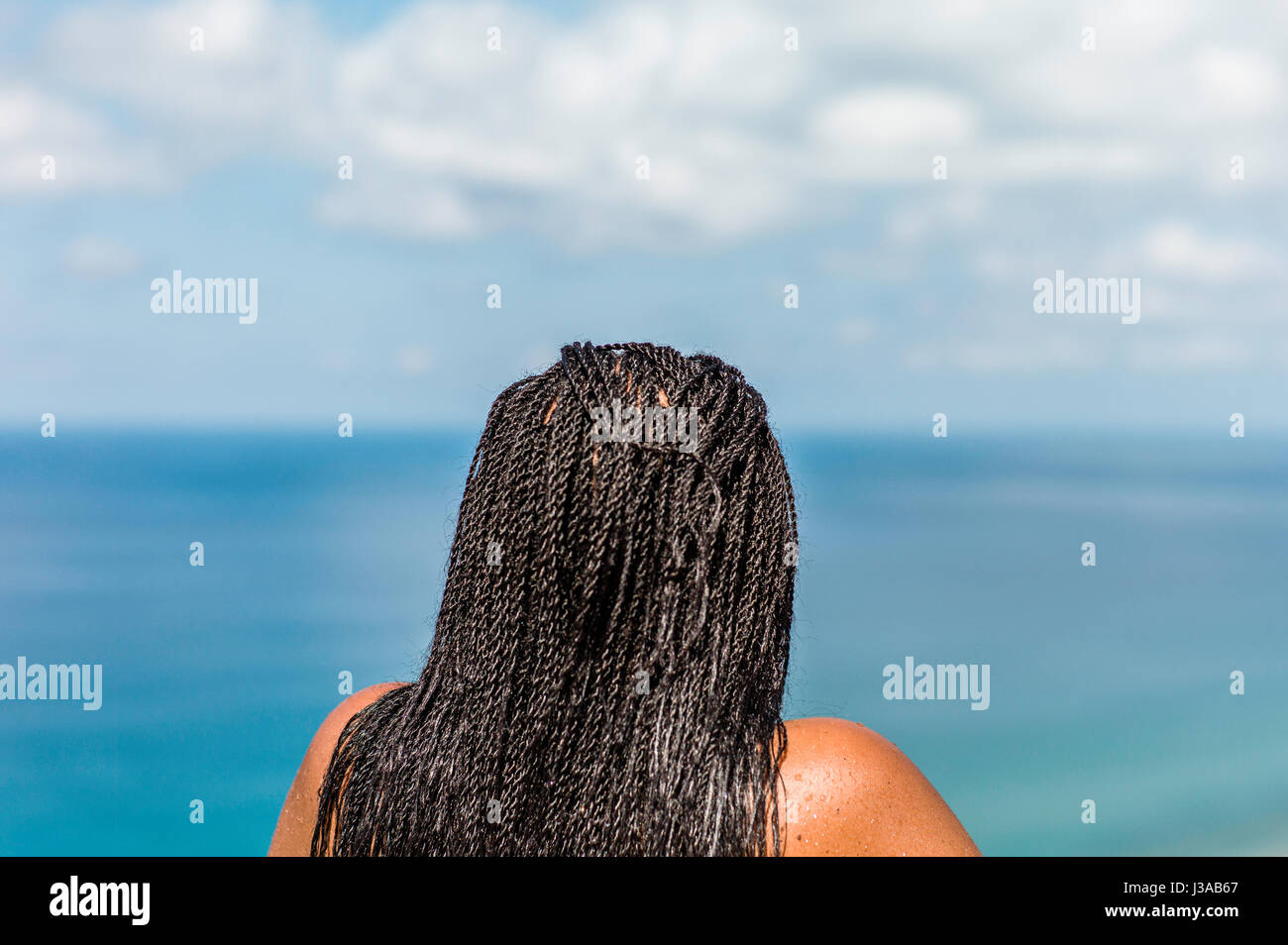 woman in the sun overlooking the sea Stock Photo - Alamy