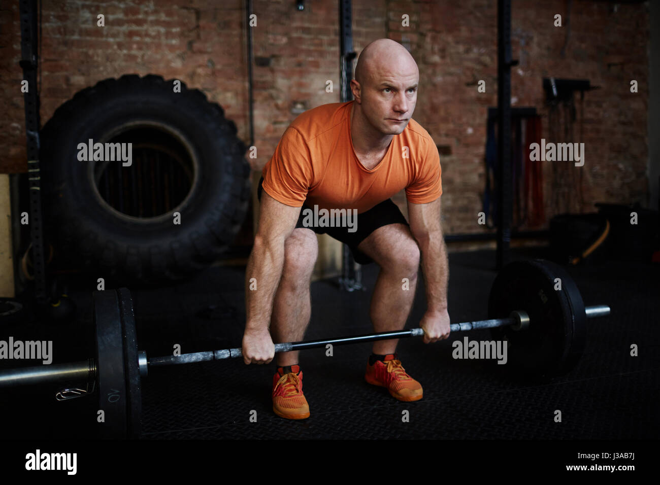 Fit Man Lifting Barbell Stock Photo - Alamy