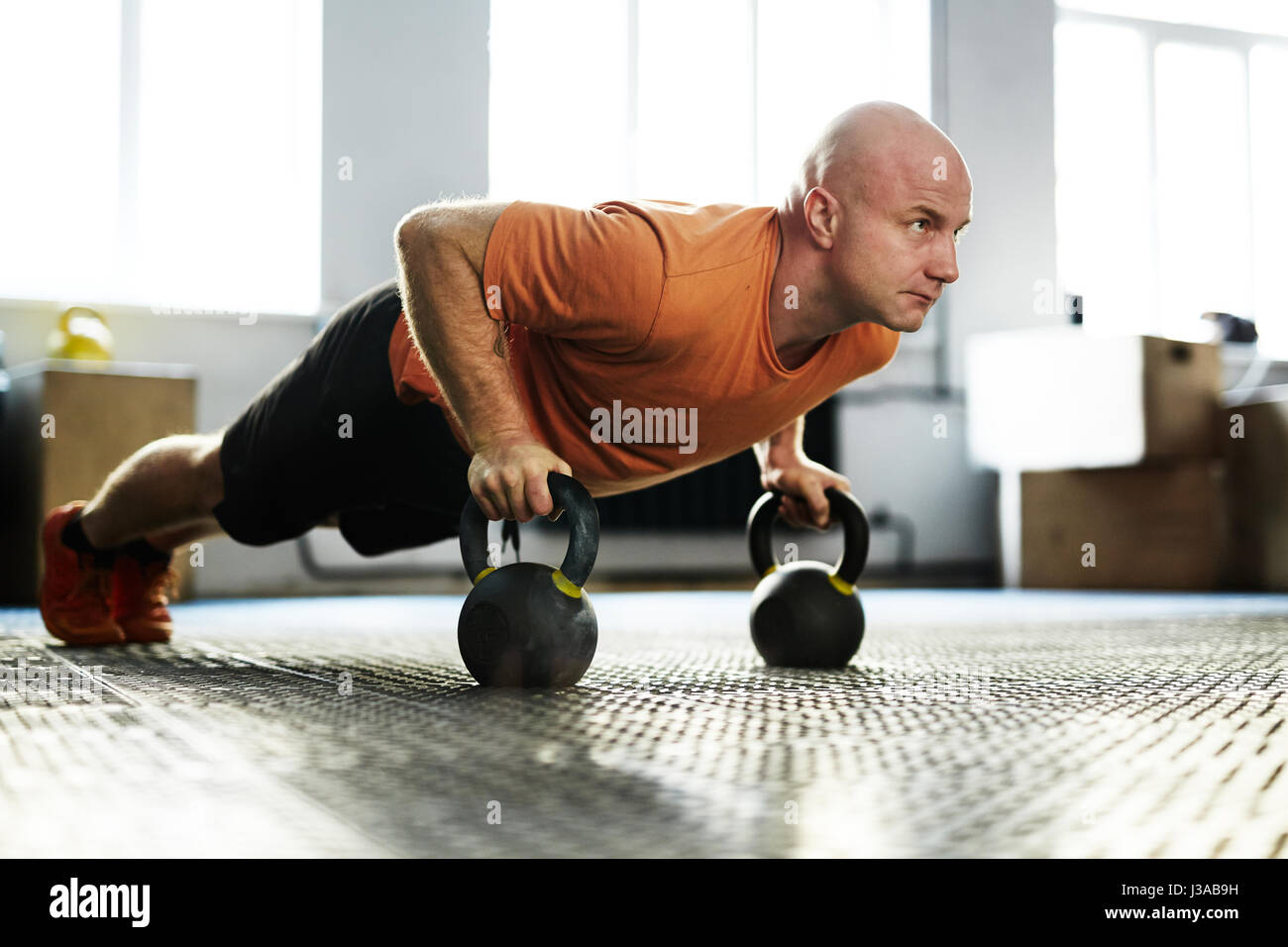 Exercising in Modern Gym Stock Photo - Alamy