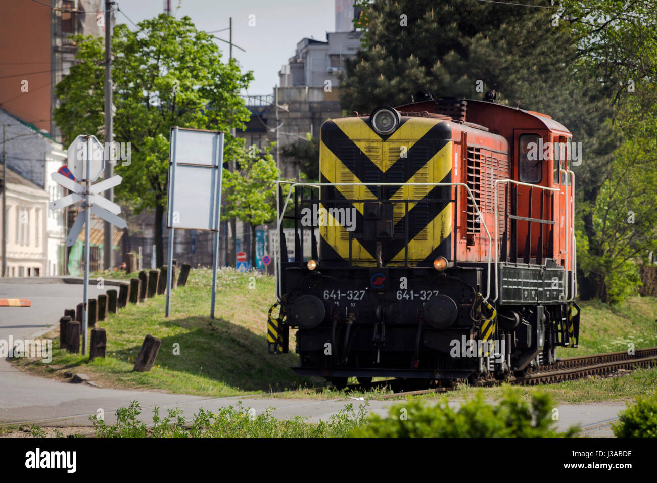 Tug locomotive on its way to storage depot yard Stock Photo - Alamy