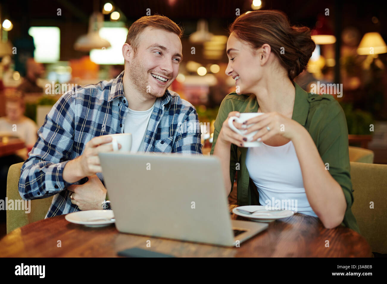 Couple Having Good Time in Cafe Stock Photo - Alamy