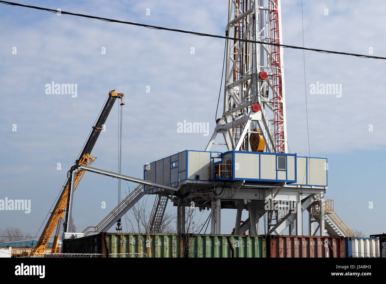 oil drilling rig and crane Stock Photo - Alamy