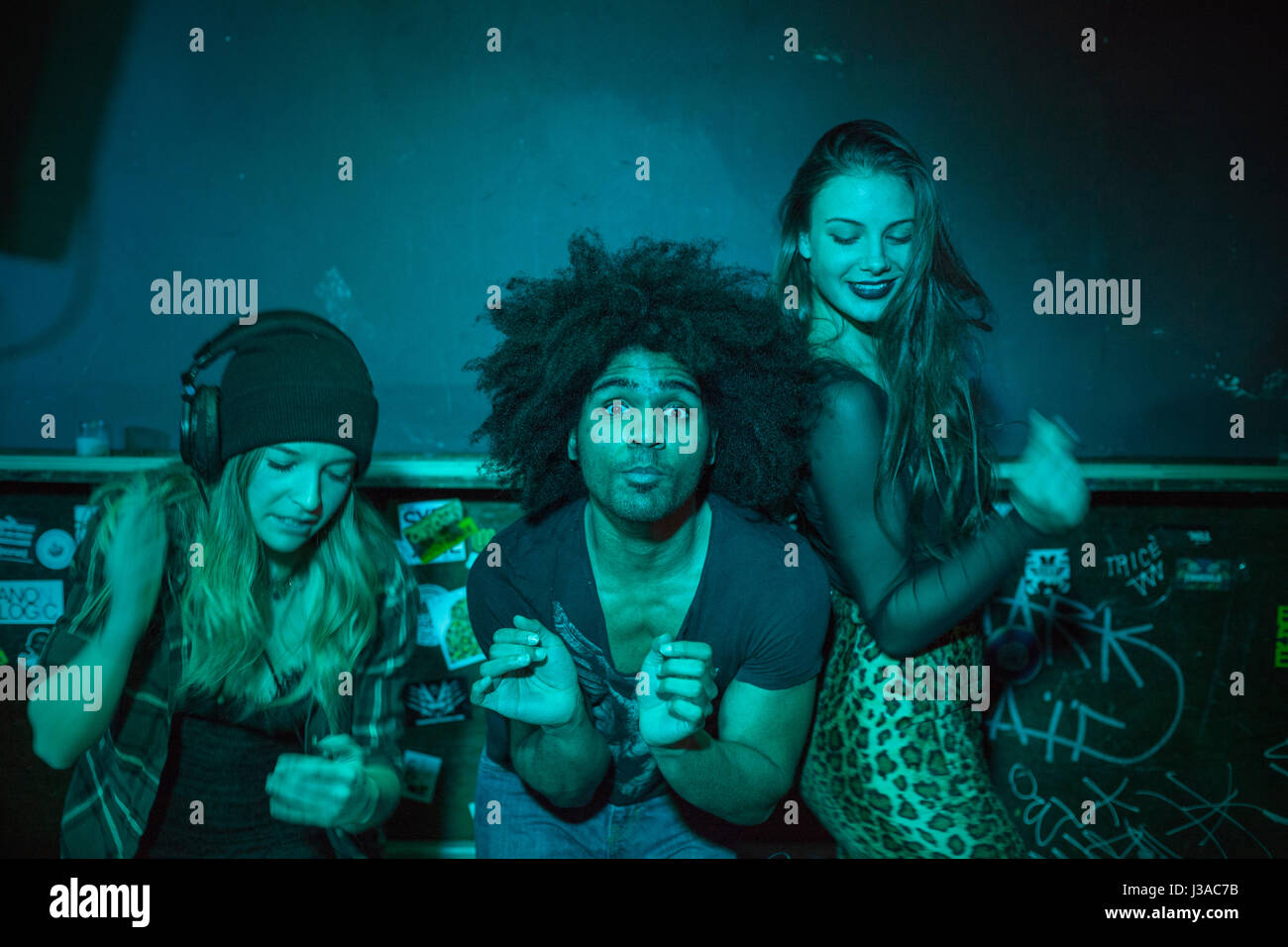Friends hanging out at a nightclub Stock Photo - Alamy