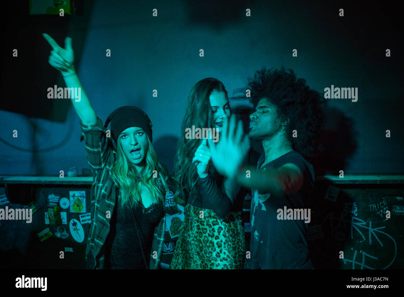 Friends hanging out at a nightclub Stock Photo - Alamy