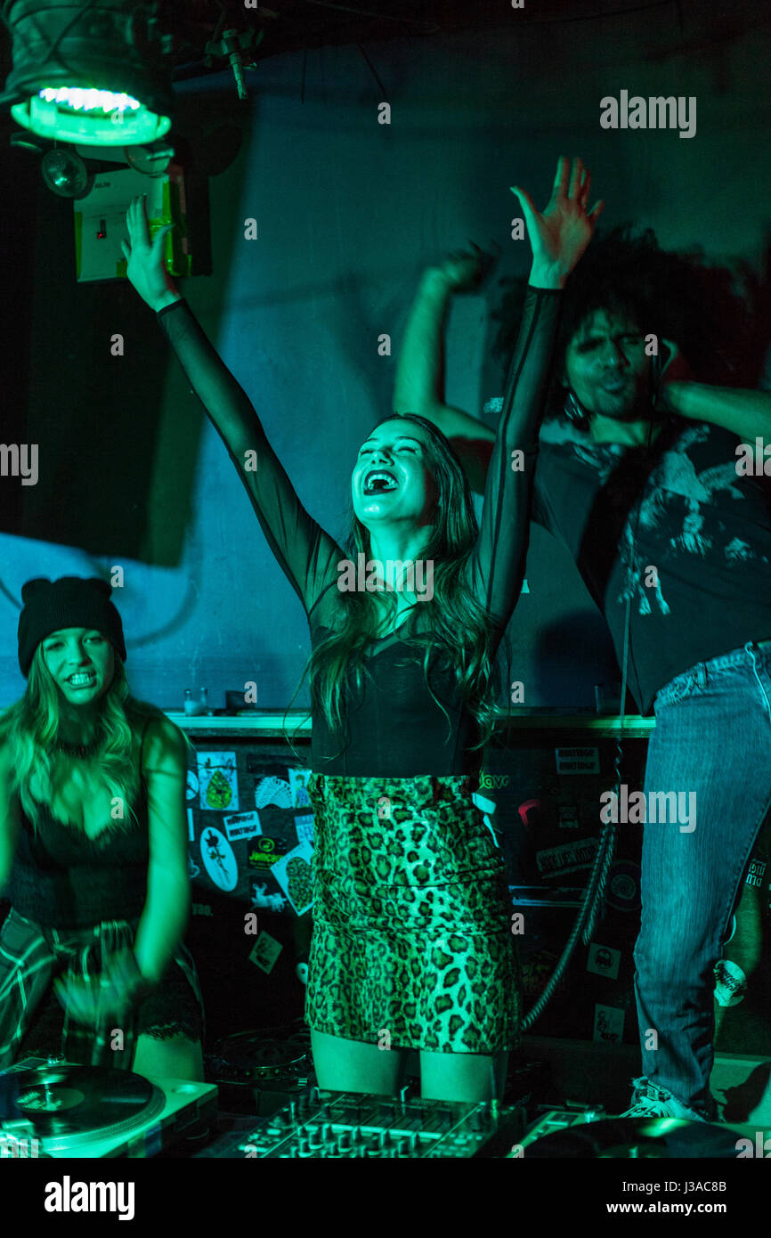 Friends hanging out at a nightclub Stock Photo - Alamy