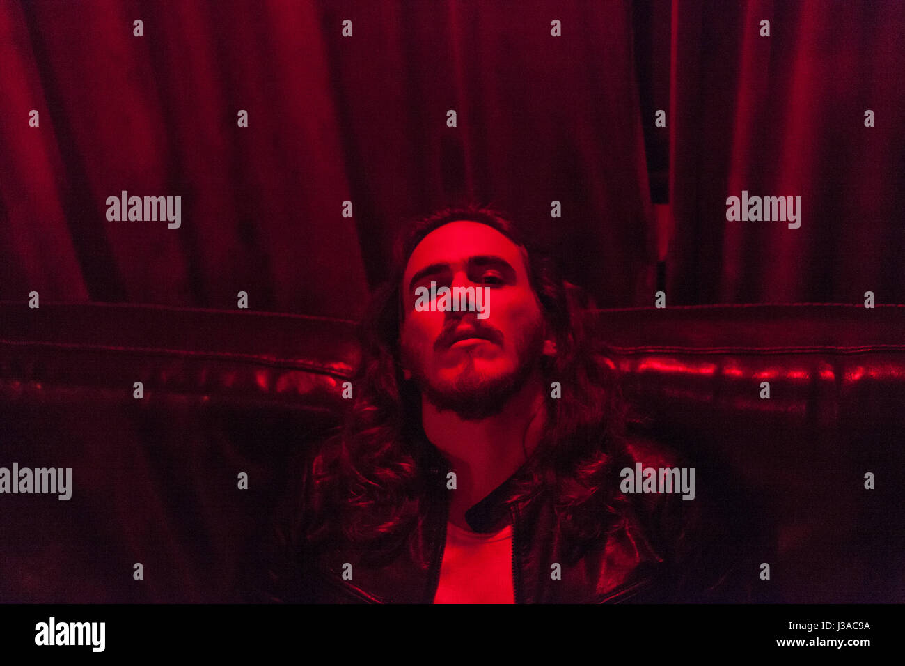 Portrait of a handsome young man in a nightclub Stock Photo - Alamy
