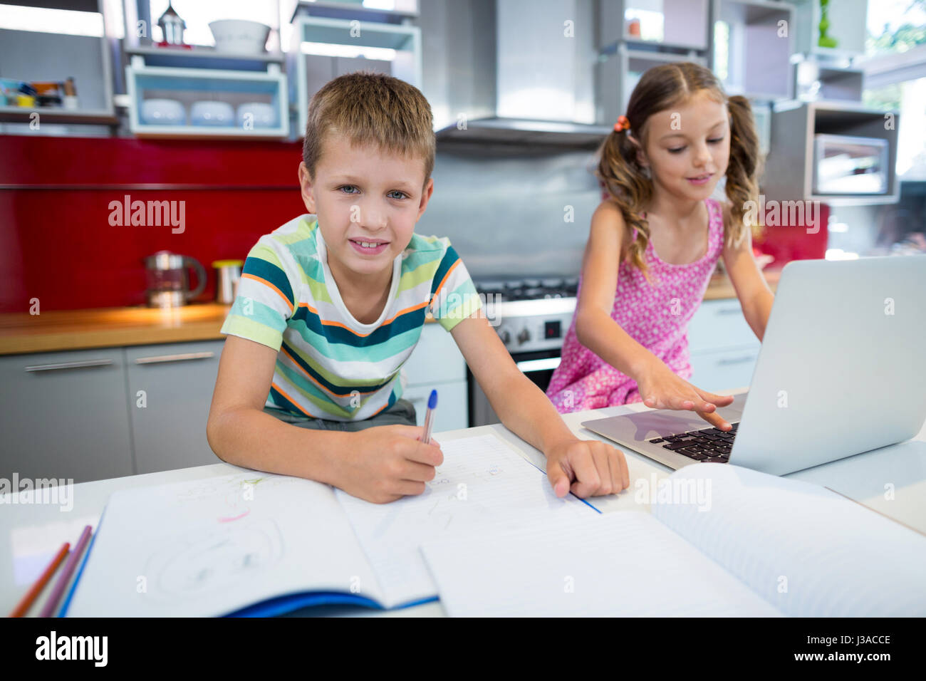 Boy doing homework home browsing hi-res stock photography and images ...