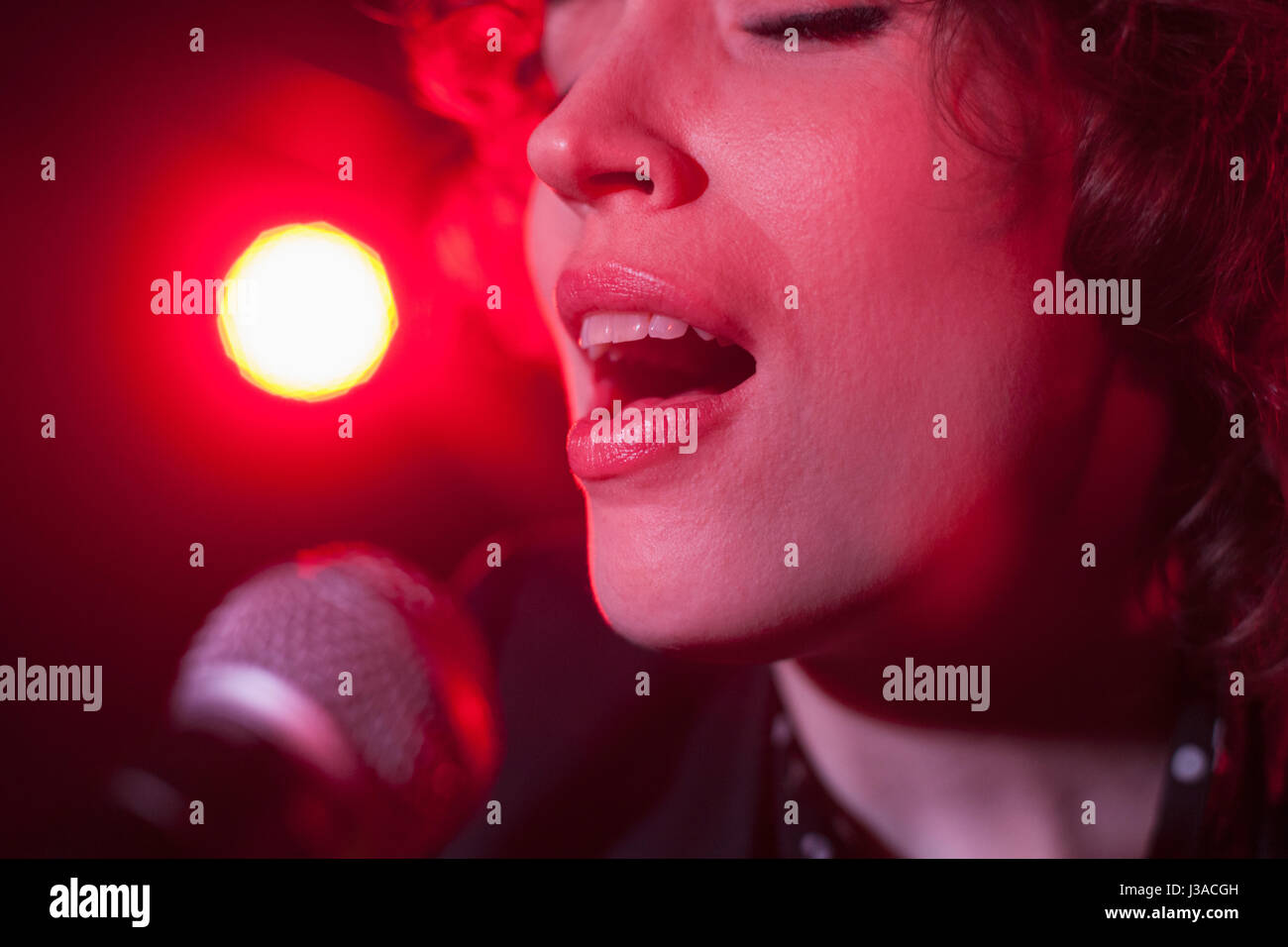Singer performing at a nightclub Stock Photo - Alamy