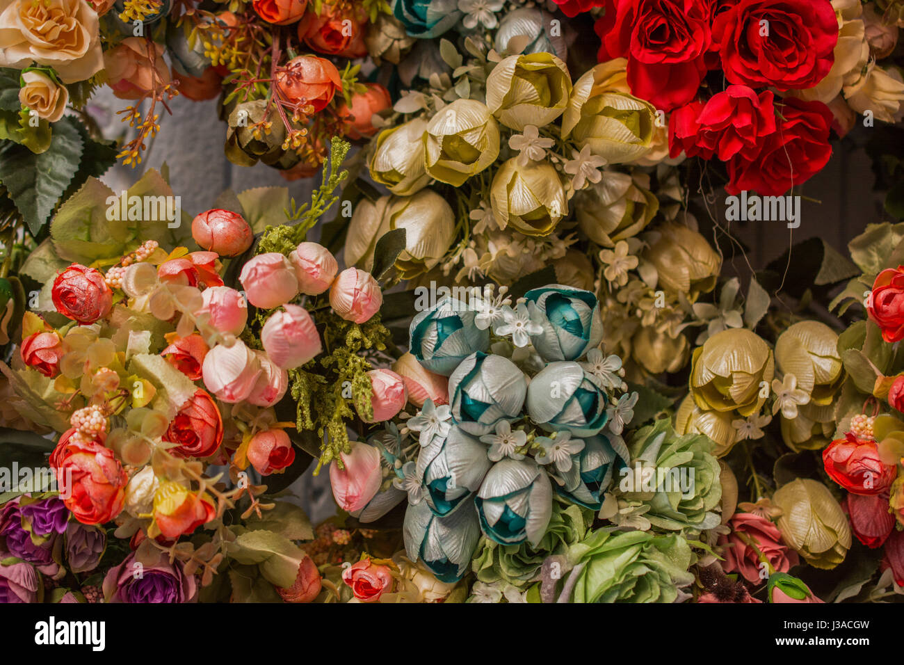 Fake colorful flowers for decorative purposes Stock Photo - Alamy