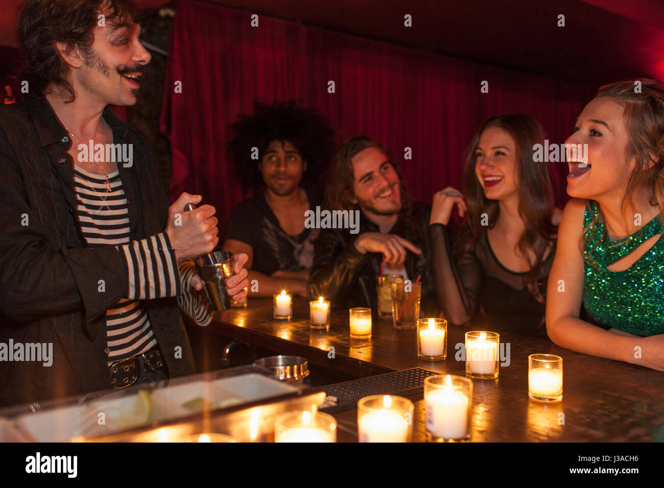 Bartender serving drinks at a nightclub Stock Photo - Alamy