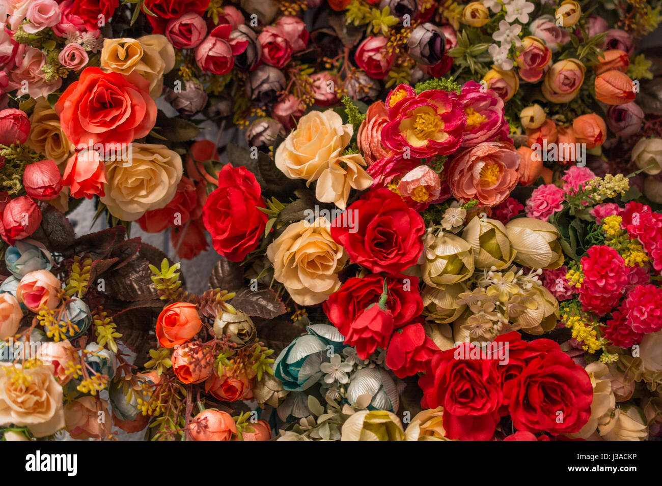 Fake colorful flowers for decorative purposes Stock Photo - Alamy
