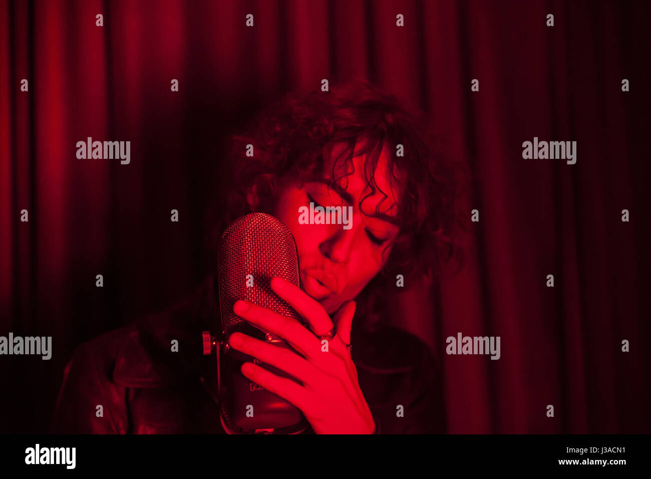 Singer performing at a nightclub Stock Photo - Alamy