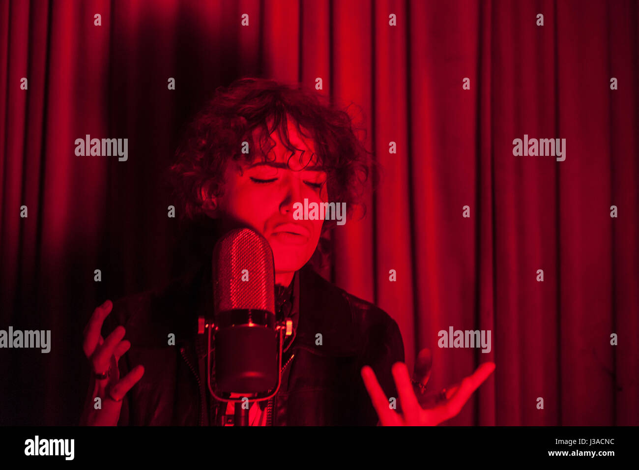 Singer performing at a nightclub Stock Photo - Alamy