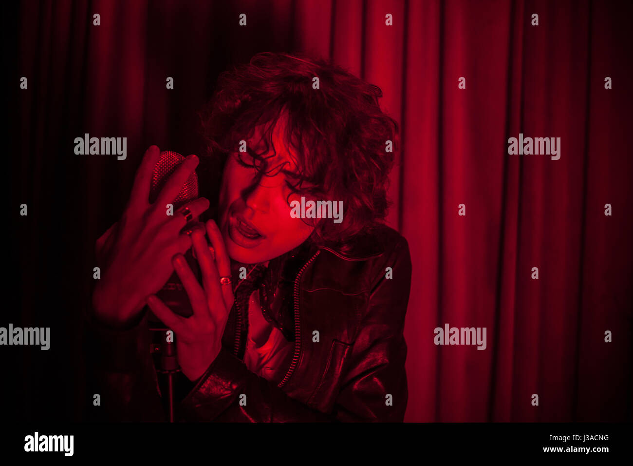 Singer performing at a nightclub Stock Photo - Alamy