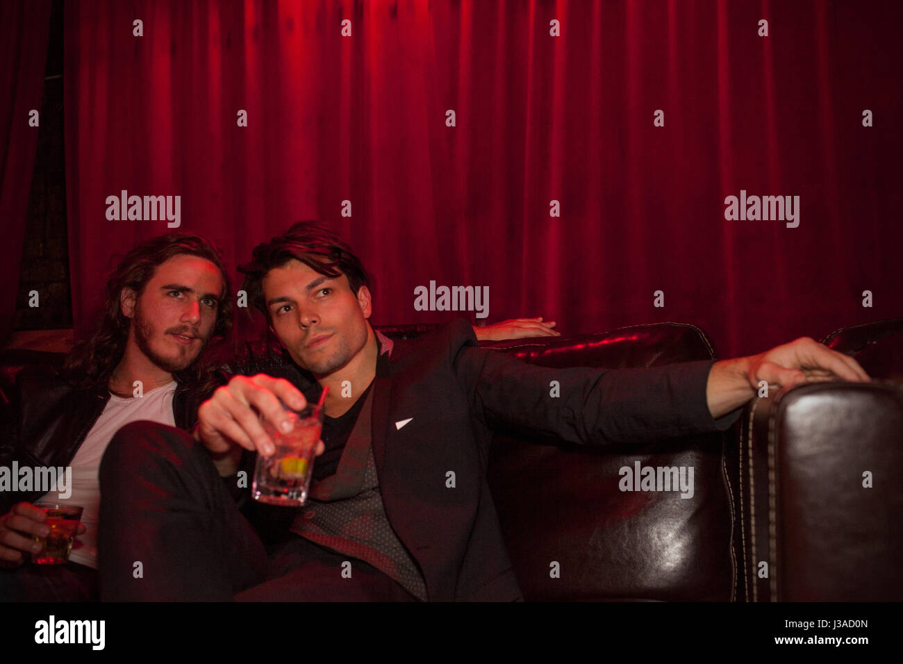 Young men hanging out at a nightclub Stock Photo - Alamy
