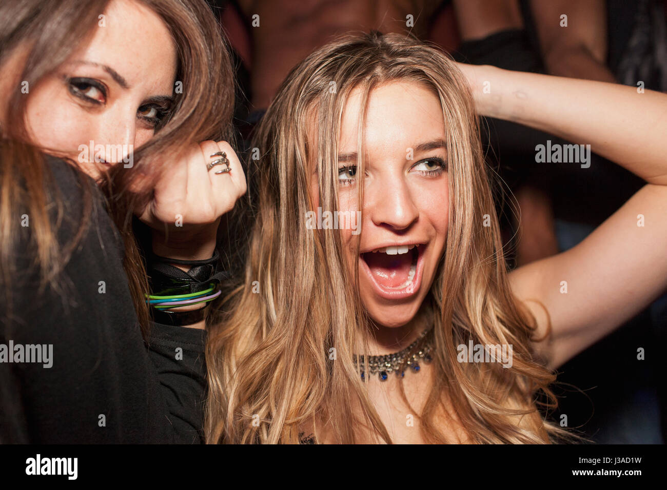 Friends hanging out at a nightclub Stock Photo - Alamy