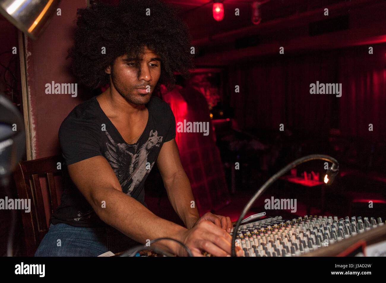 Young man djing at a night club Stock Photo - Alamy