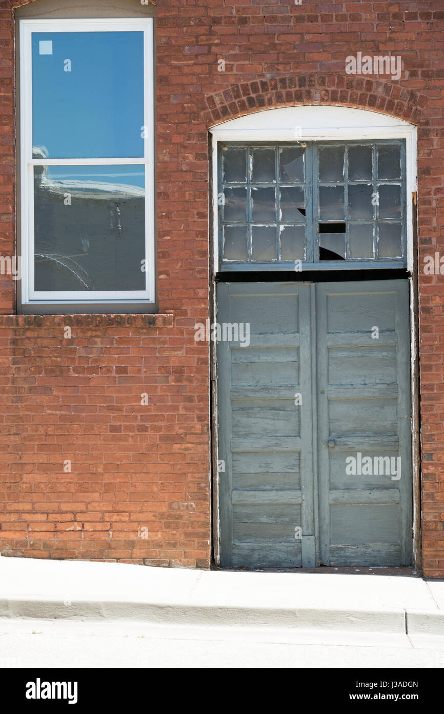 Old door and window on brick building Stock Photo - Alamy