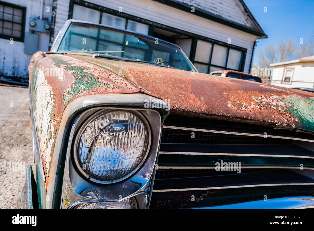 GOSHEN, VIRGINIA- APRIL 8 2017: Old car rusting away in front of an ...