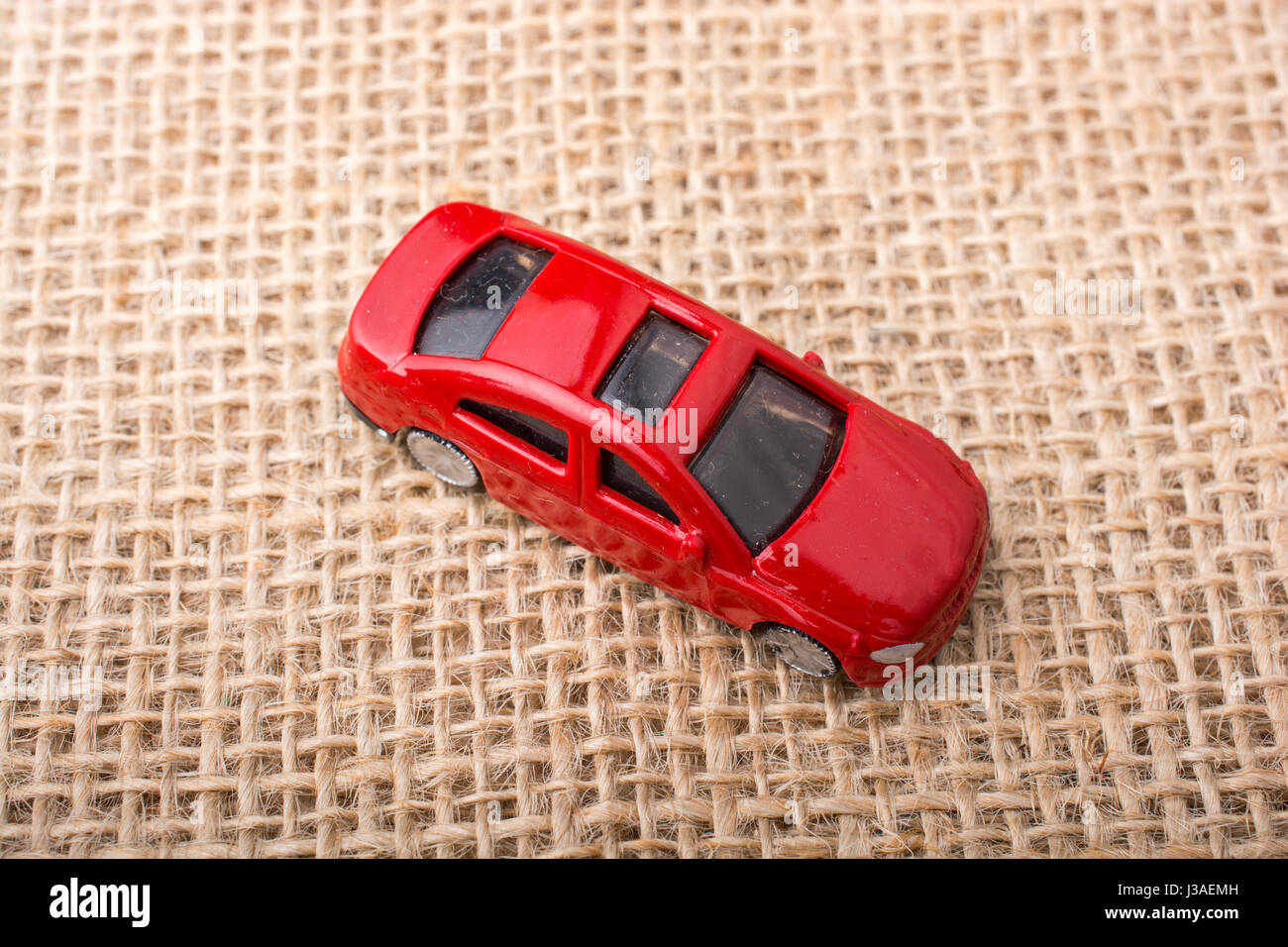 Colorful little toy car on canvas background Stock Photo - Alamy
