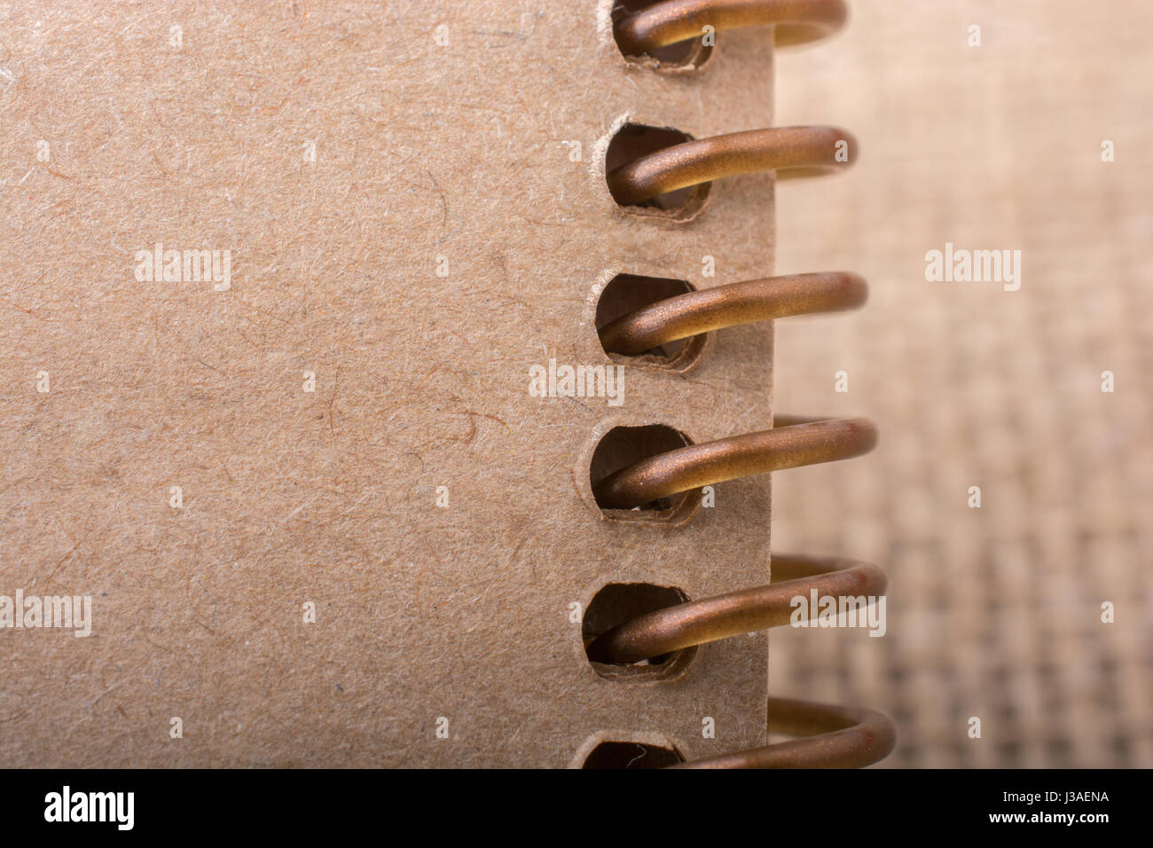 brown color notebook placed on a canvas background Stock Photo - Alamy